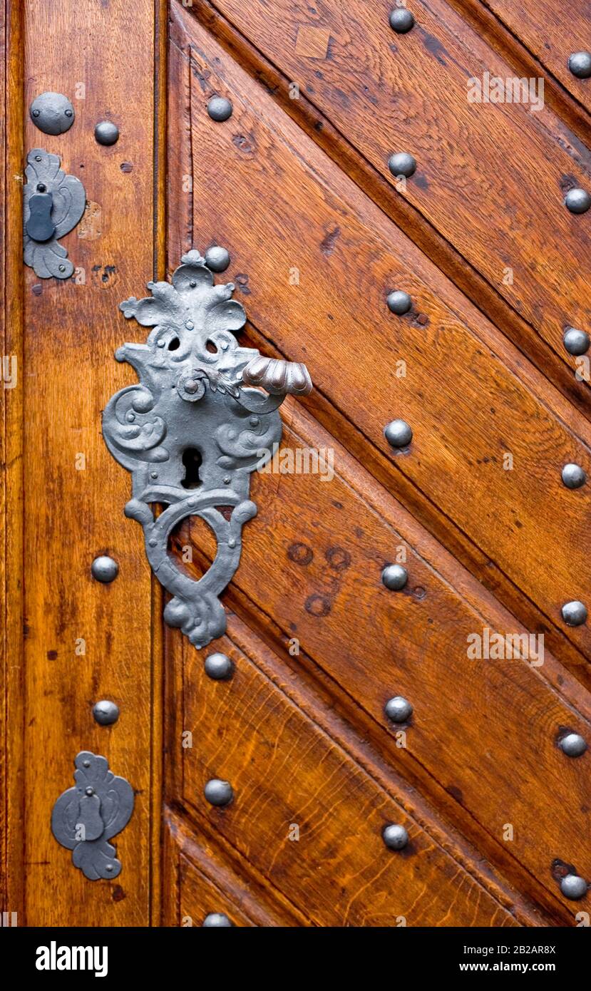 Old door handle with beautiful design Stock Photo - Alamy