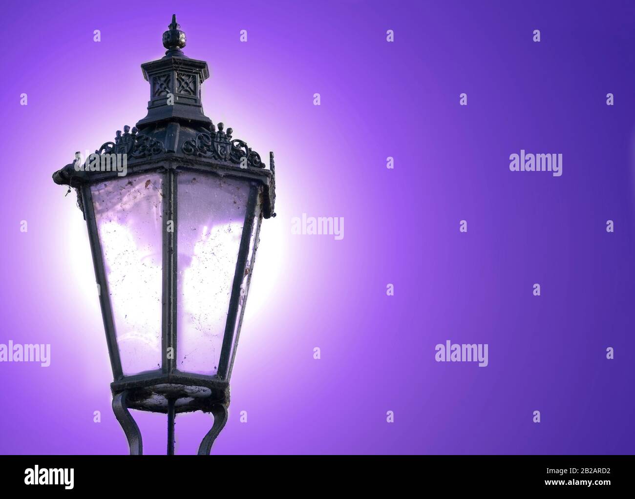 Old lantern with purple light arround it Stock Photo - Alamy
