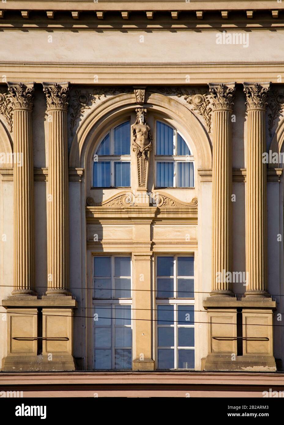 Detail from an old building - columns, sculpture and windows Stock ...