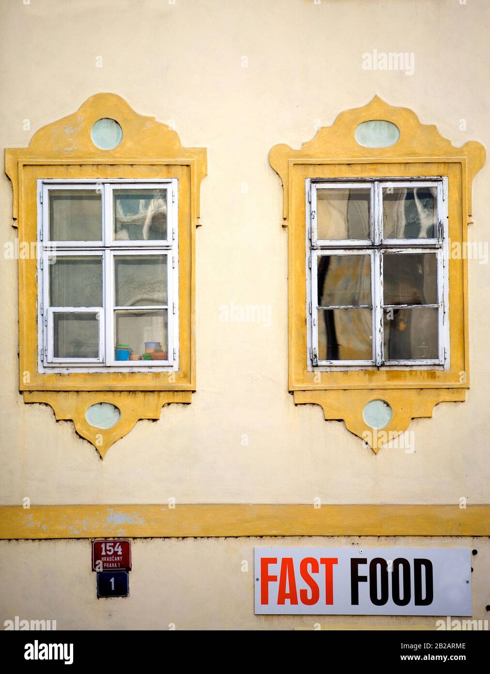 Old woodens window and a stylish plaster frame Stock Photo - Alamy