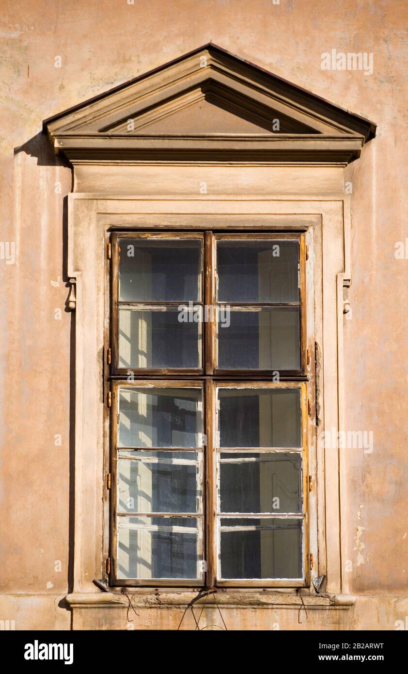 Old weathered window and a stylish plaster frame Stock Photo - Alamy