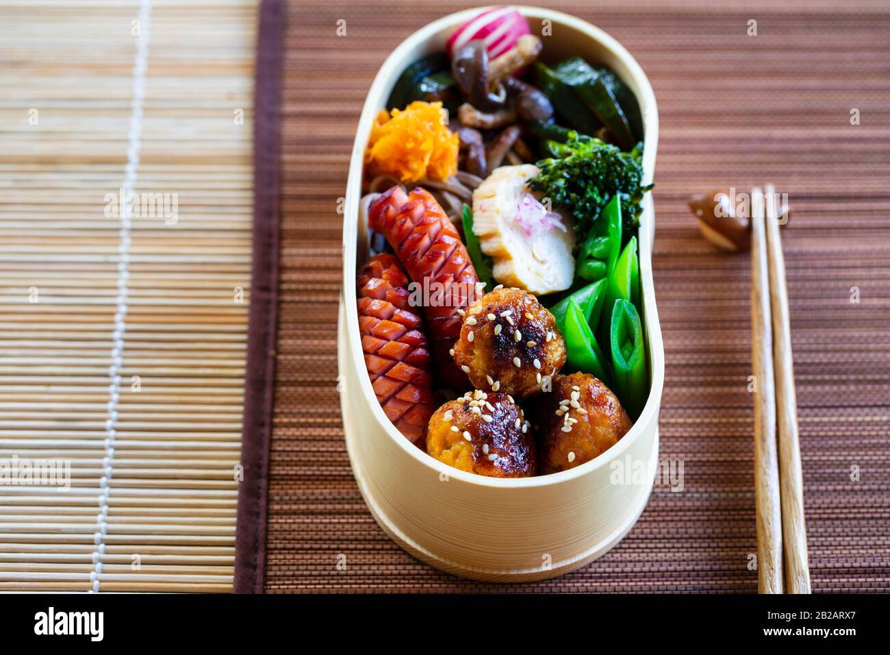 Japanese bento box with meatballs, sausage and vegetables Stock Photo ...