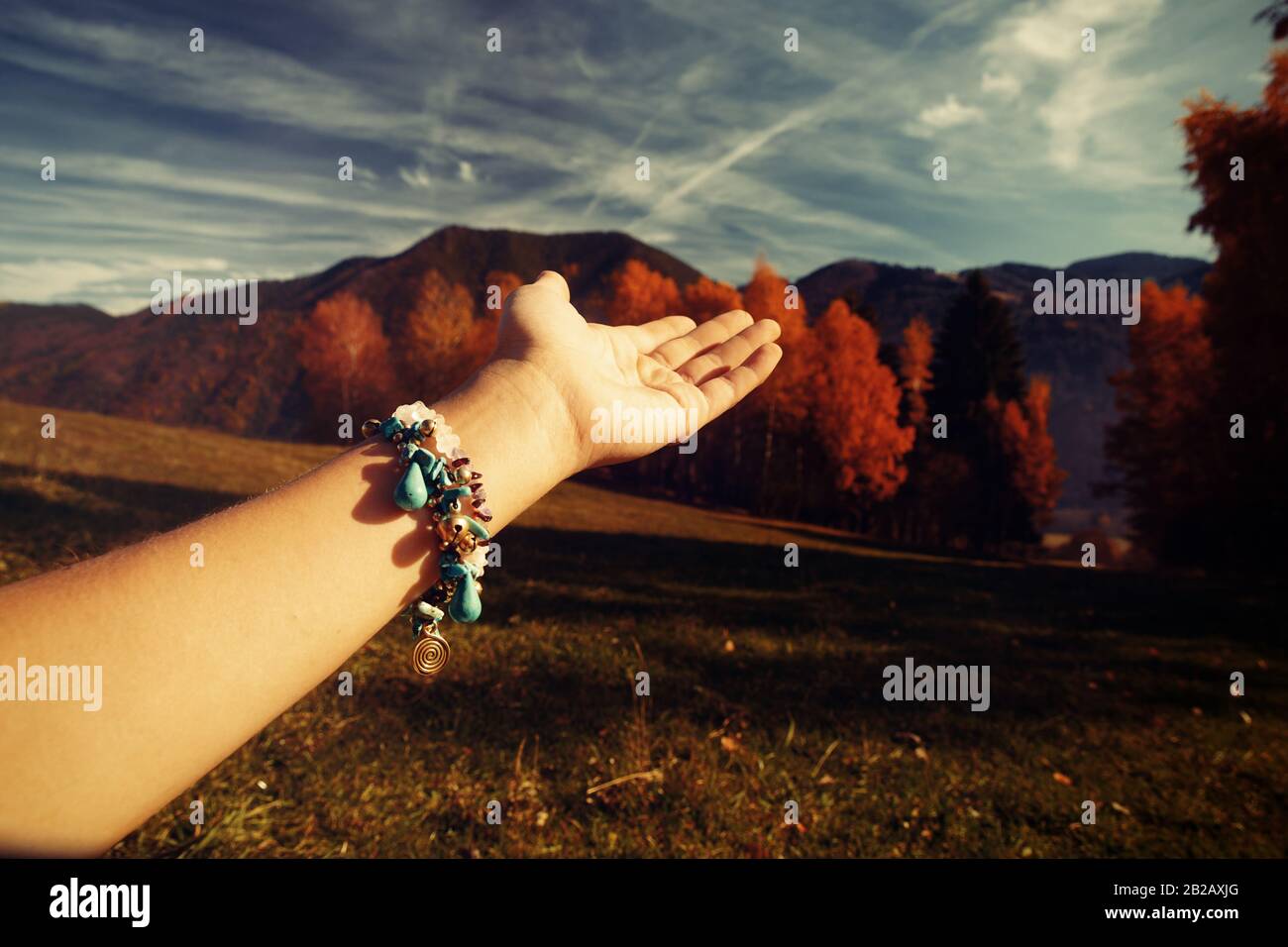 Beautiful landscape and woman hand with jewel Stock Photo - Alamy