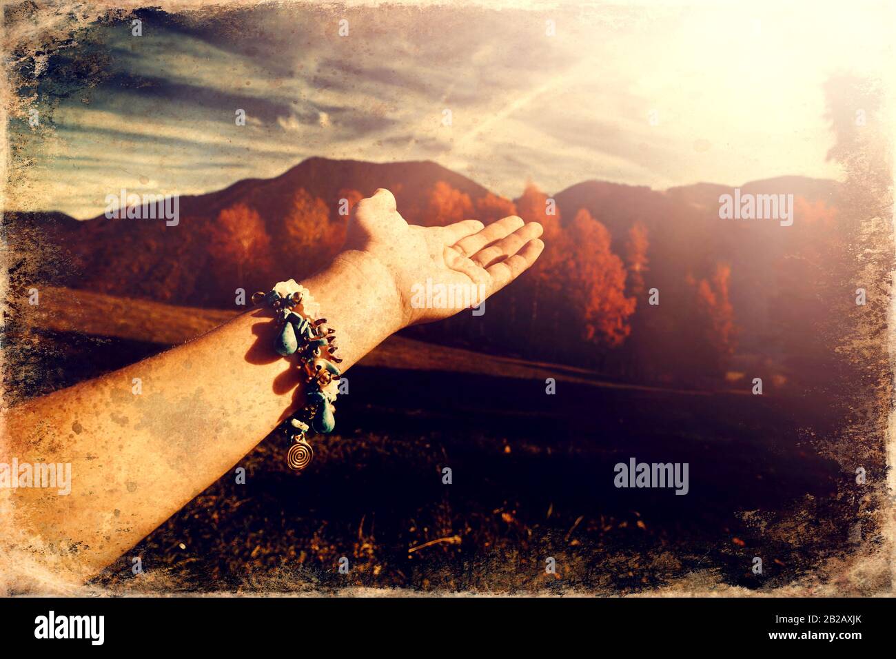 Beautiful landscape and woman hand with jewel Stock Photo - Alamy