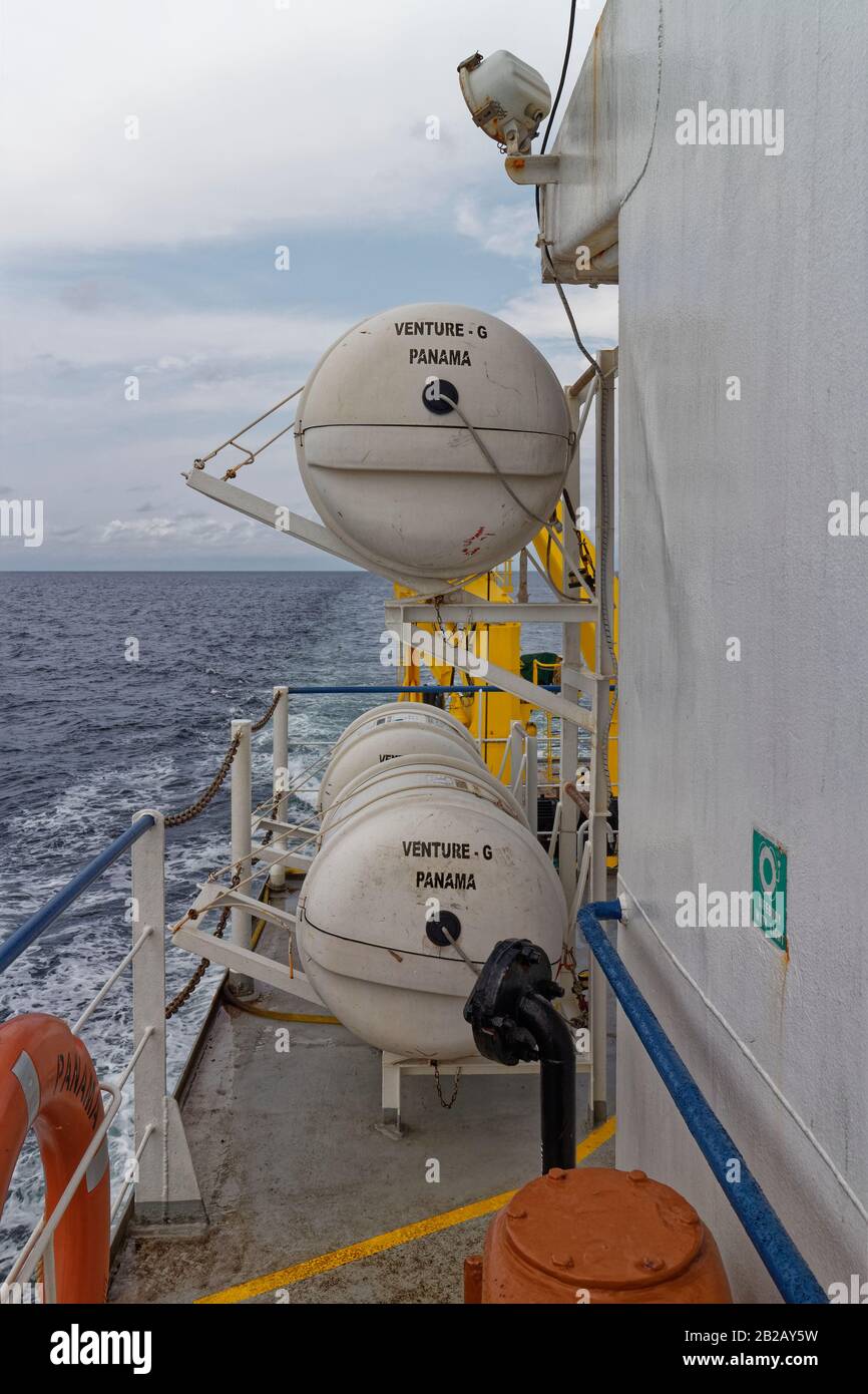 Liferafts in their quick release cradles on the starboard side of an ...