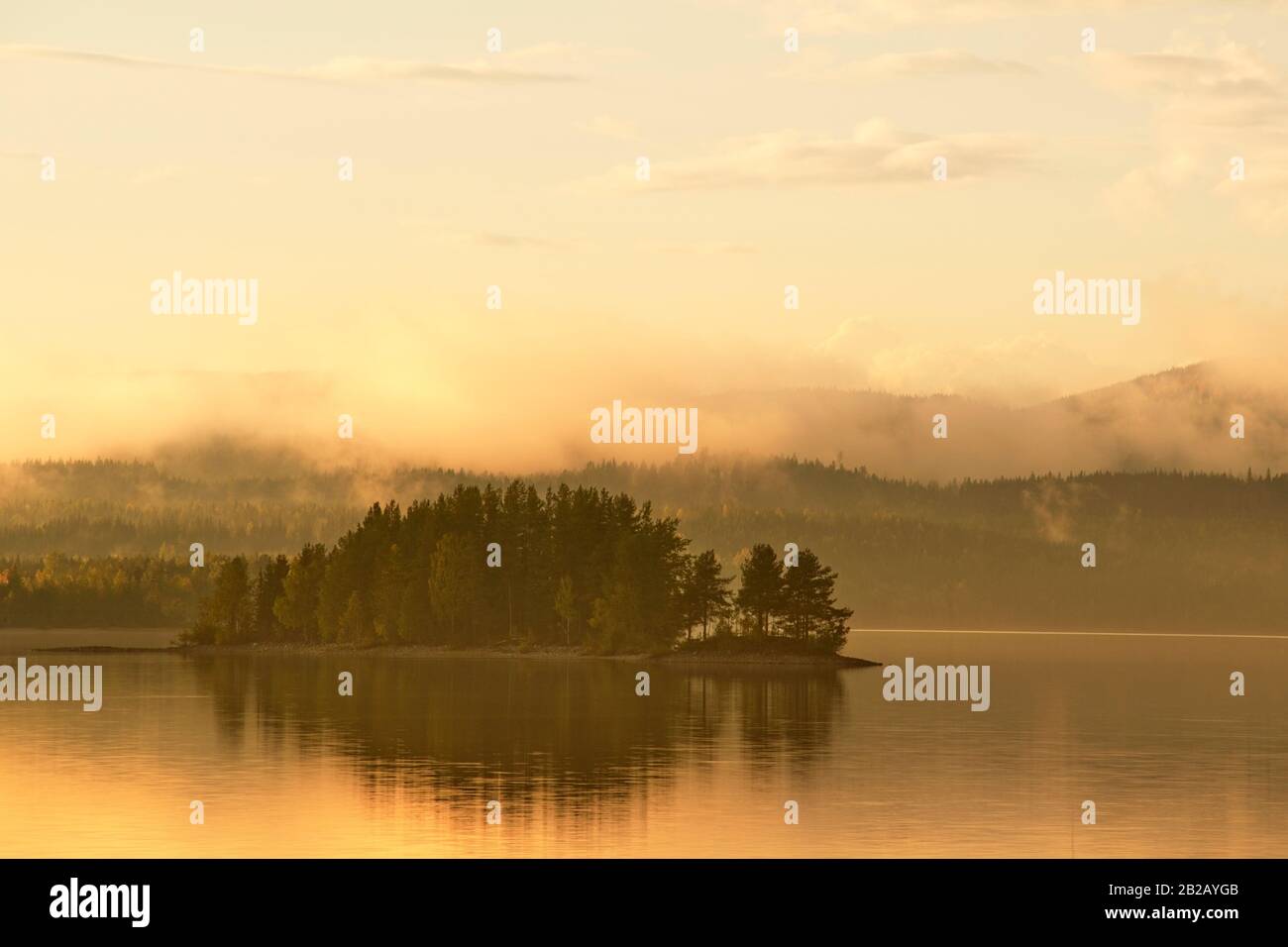 Sunrise over small island in mist hi-res stock photography and images ...