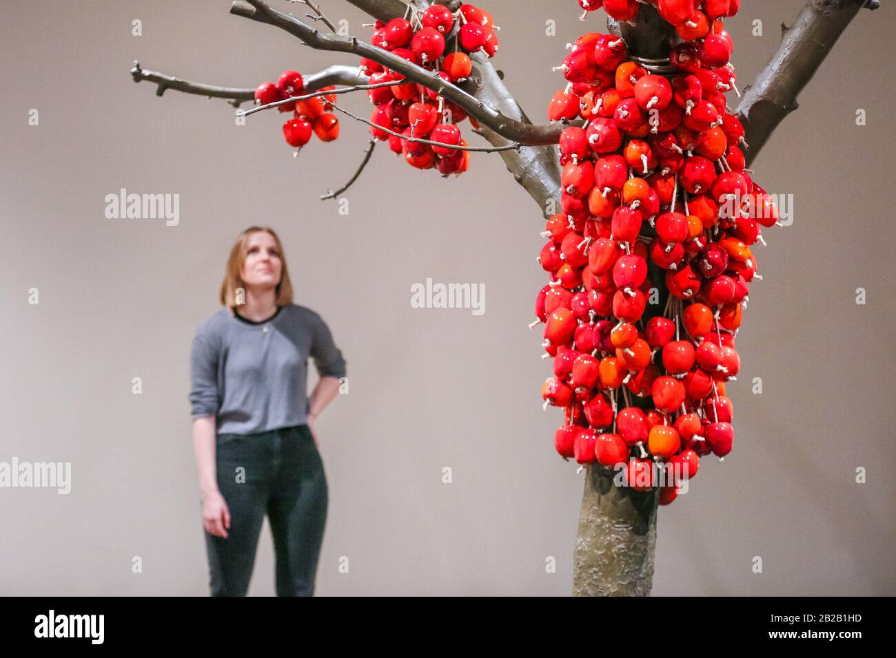 Hayward Gallery, London, UK. 2nd Mar, 2020. An assistant with 'Because ...