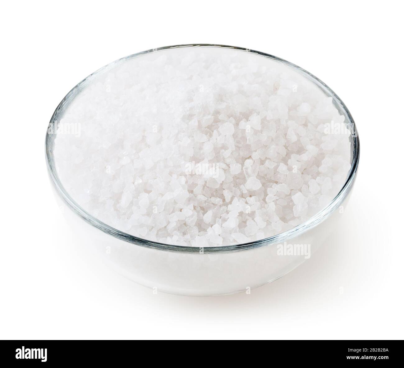 Sea salt in glass bowl isolated on white background with clipping path ...