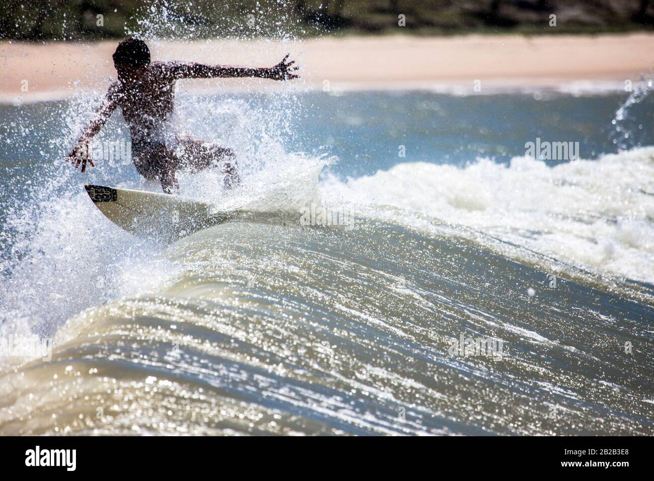 Man surfing in ocean Stock Photo - Alamy