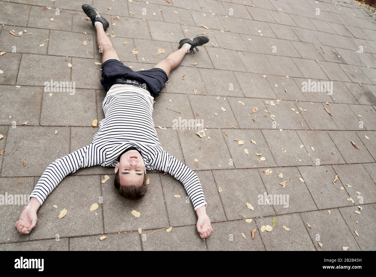Man Lying Down On Street High Resolution Stock Photography and Images ...