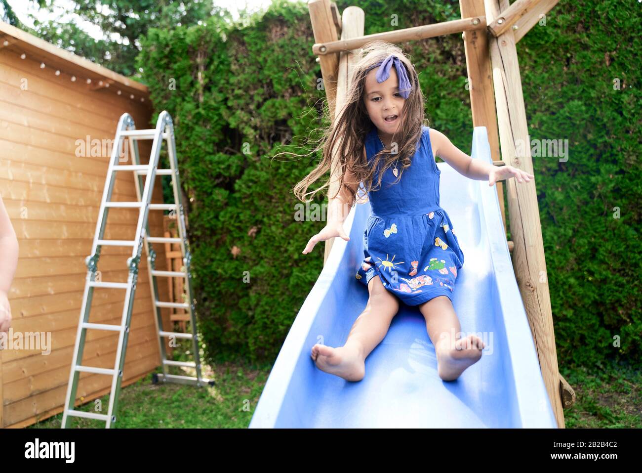 Going down the slide hi-res stock photography and images - Alamy