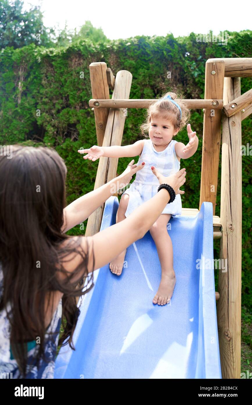 Happy Little Girl Sliding Fotolia