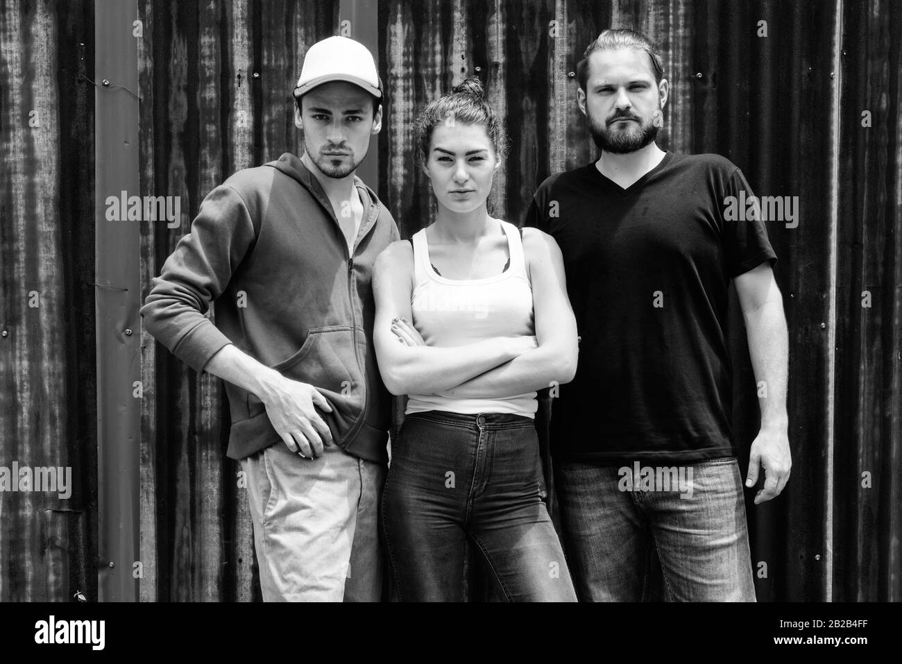 Young man posing against white Black and White Stock Photos & Images ...