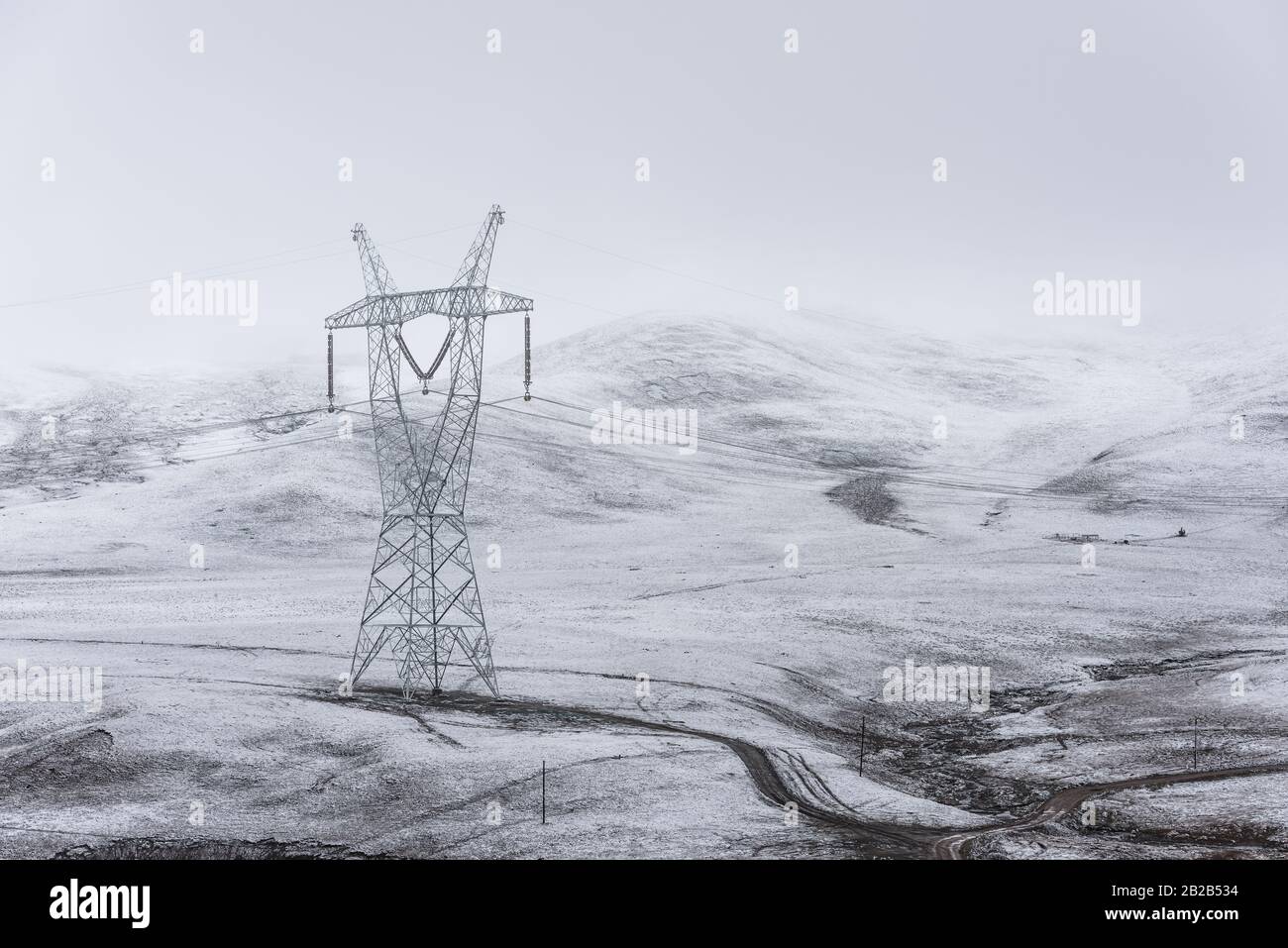 electricity pylon on a mountain which covered with snow Stock Photo - Alamy