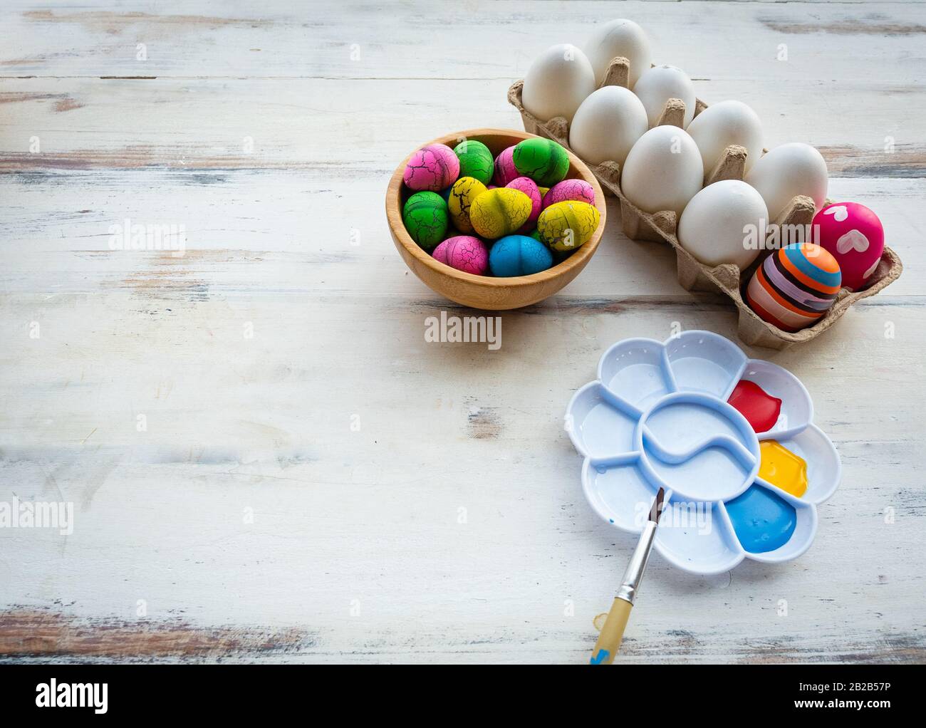 Eggs and coloring tools are prepared on the table to decorate the ...