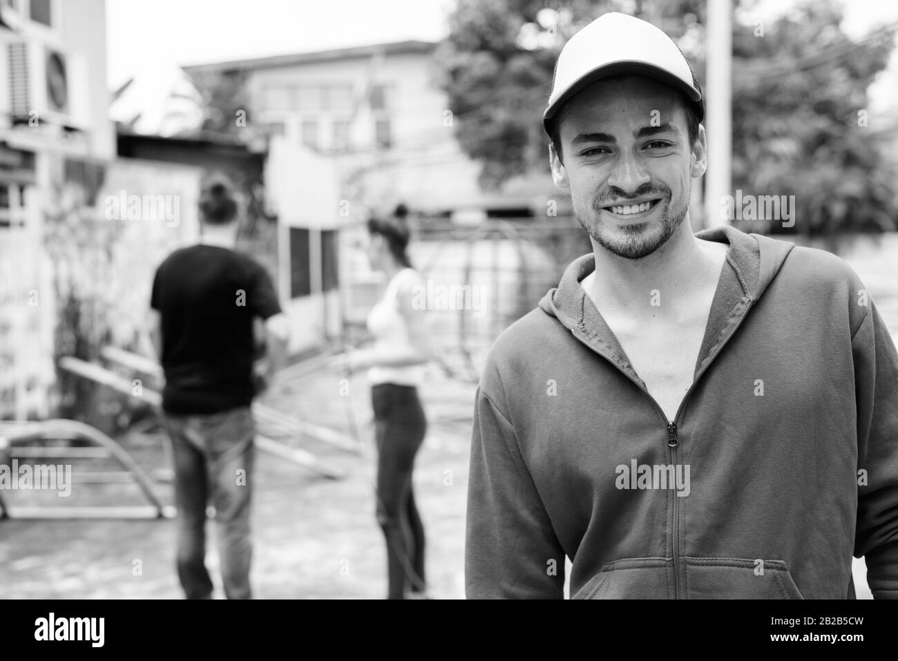 Man wearing cap talking Black and White Stock Photos & Images - Alamy