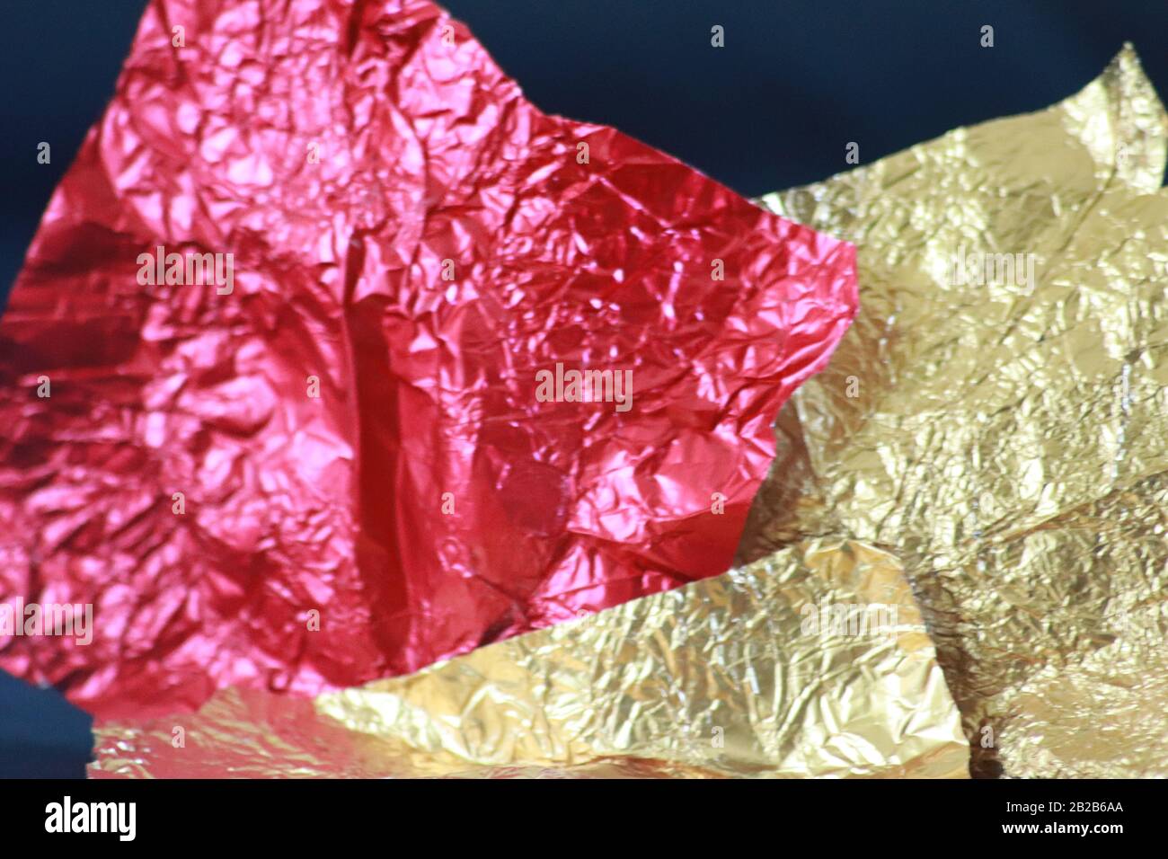 Red and gold aluminium foil Stock Photo - Alamy
