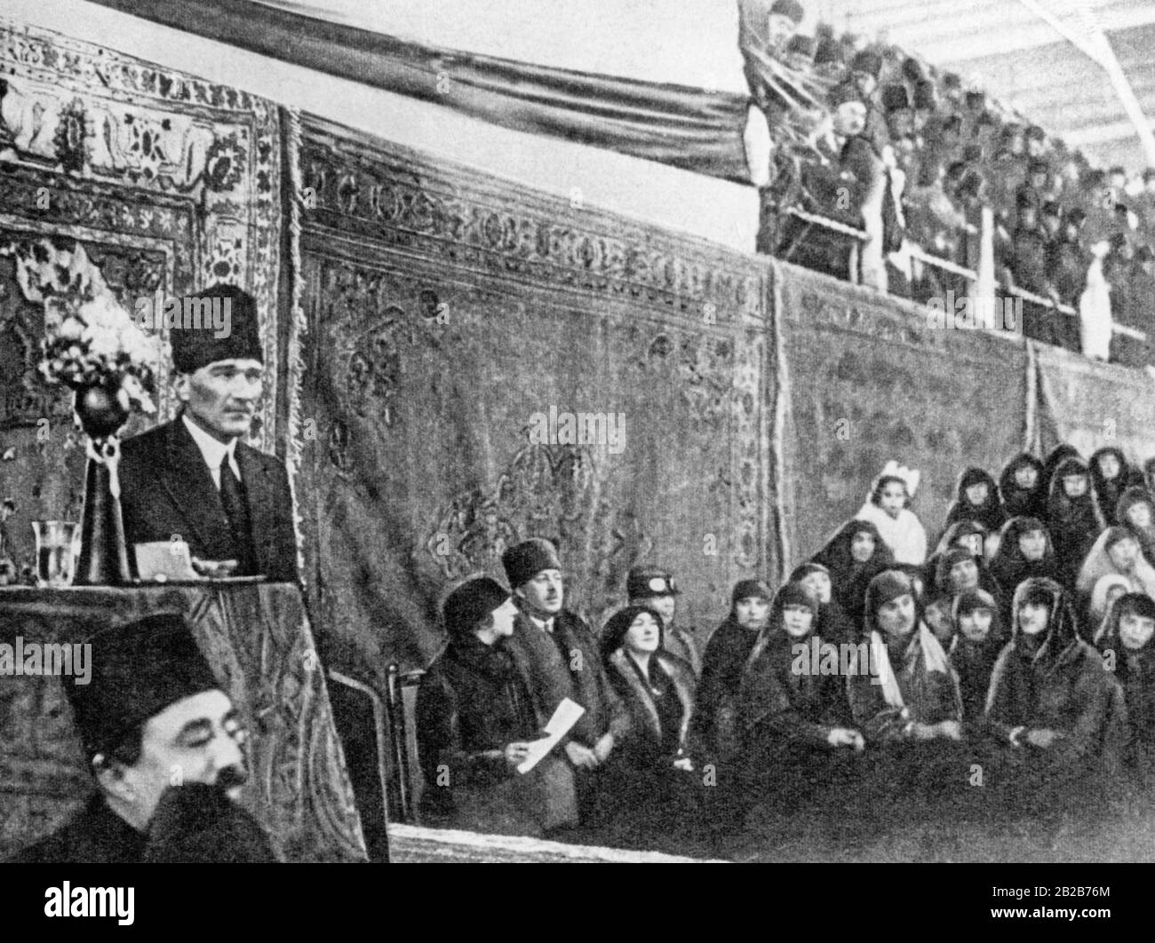 Mustafa Kemal Atatuerk at the lectern at the first women's congress in ...