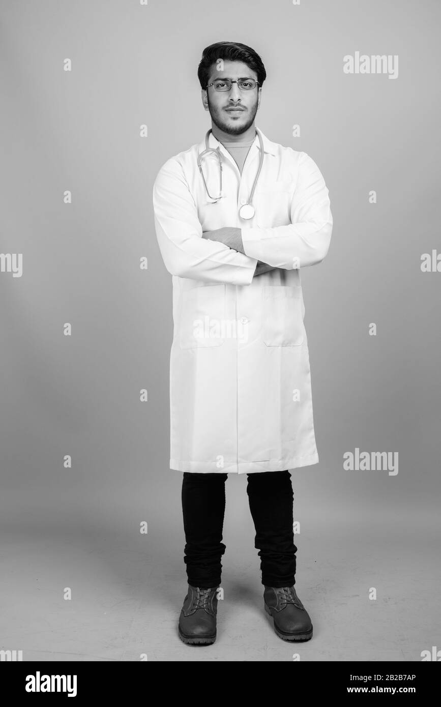 Indian male doctor full body Black and White Stock Photos & Images - Alamy