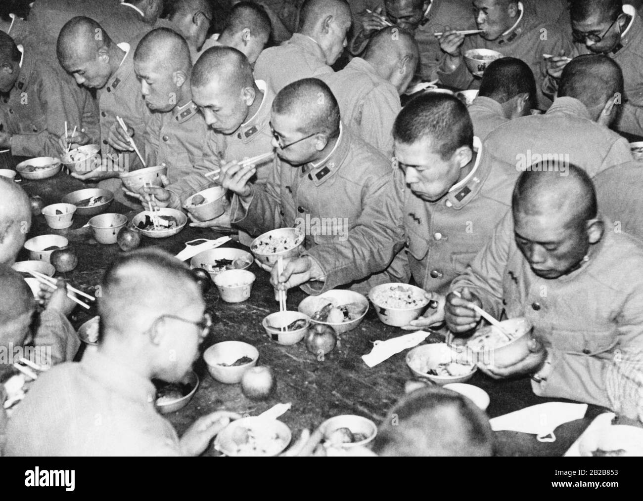 Japanese cadets in a military barracks having dinner together Stock ...