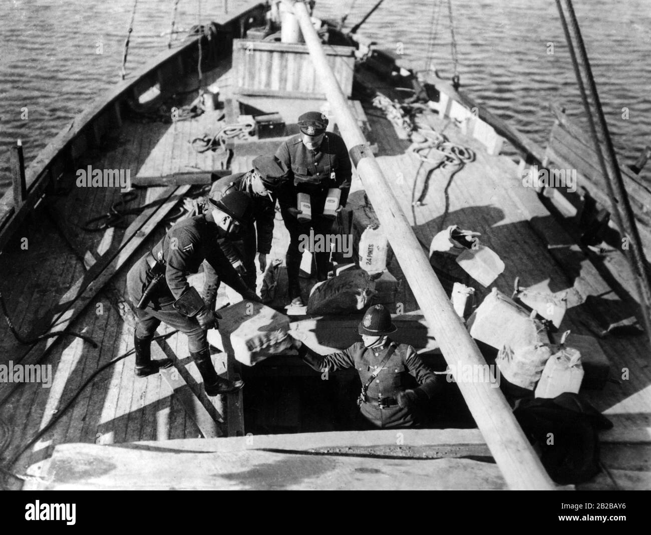Prohibition: Policemen confiscate the cargo of a rum-runner (William H ...