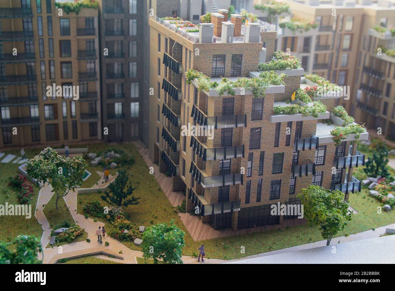 Building a model of modern housing with gardens light burning on the ...