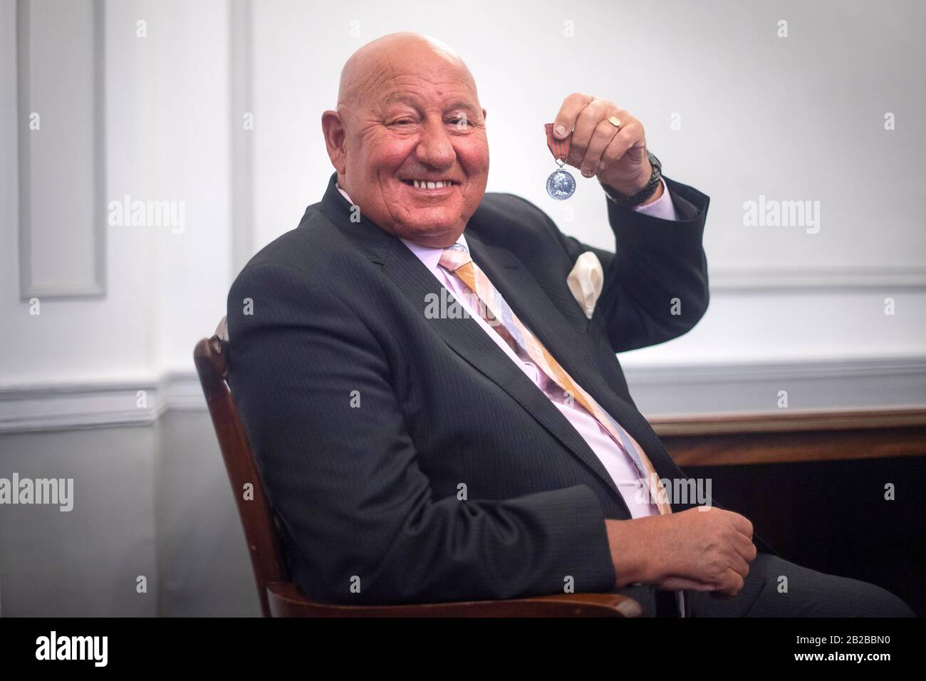 Former heavyweight boxer Ronnie Russell poses with the George Medal he ...