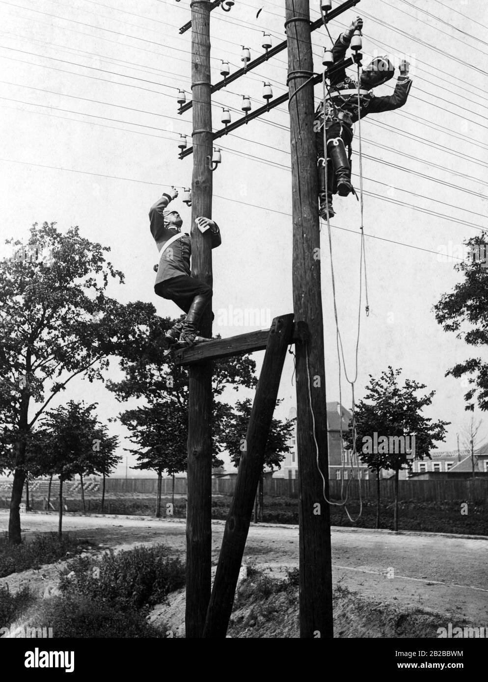 Two soldiers of the Royal Prussian Telegraph Battalion No. 1 installing ...