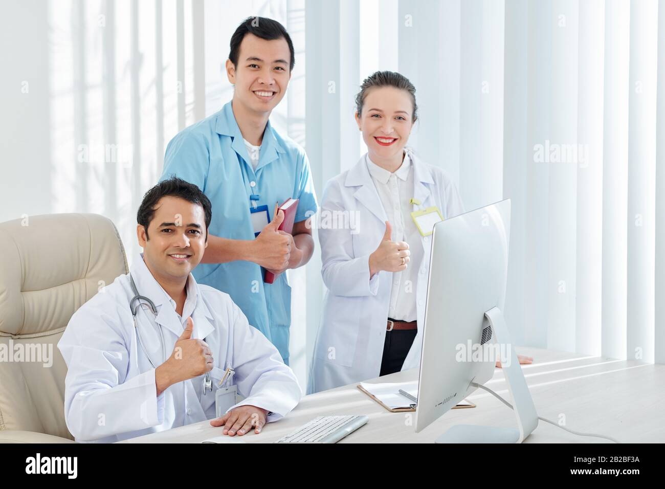 Thumbs up young indian doctor hi-res stock photography and images - Alamy