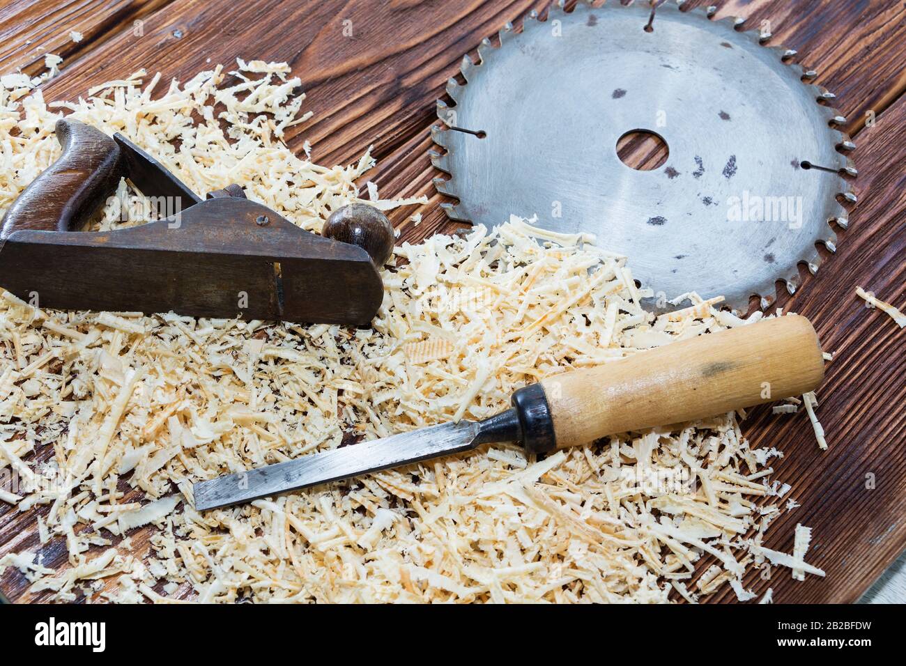 Old planter and tools for wood. Wood shop Stock Photo - Alamy