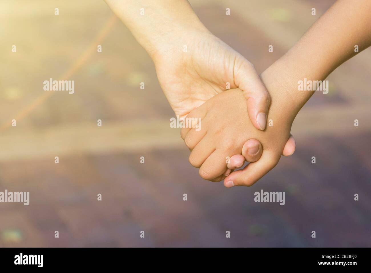 Man giving girl helping hand hi-res stock photography and images - Alamy