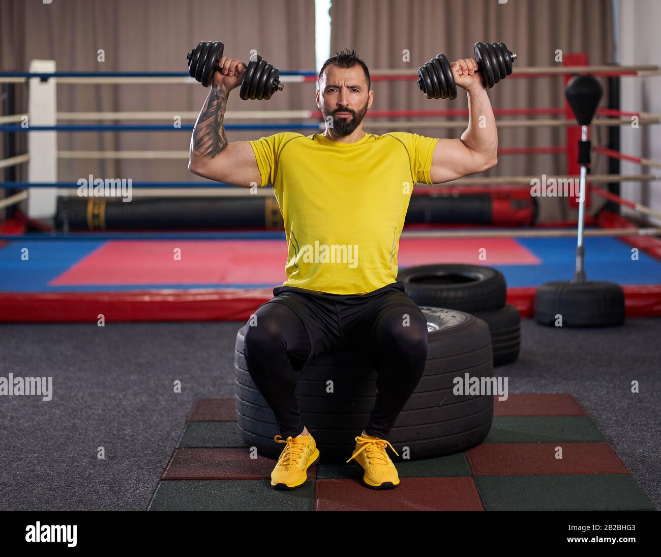 Bearded bodybuilder man exercising hi-res stock photography and images ...