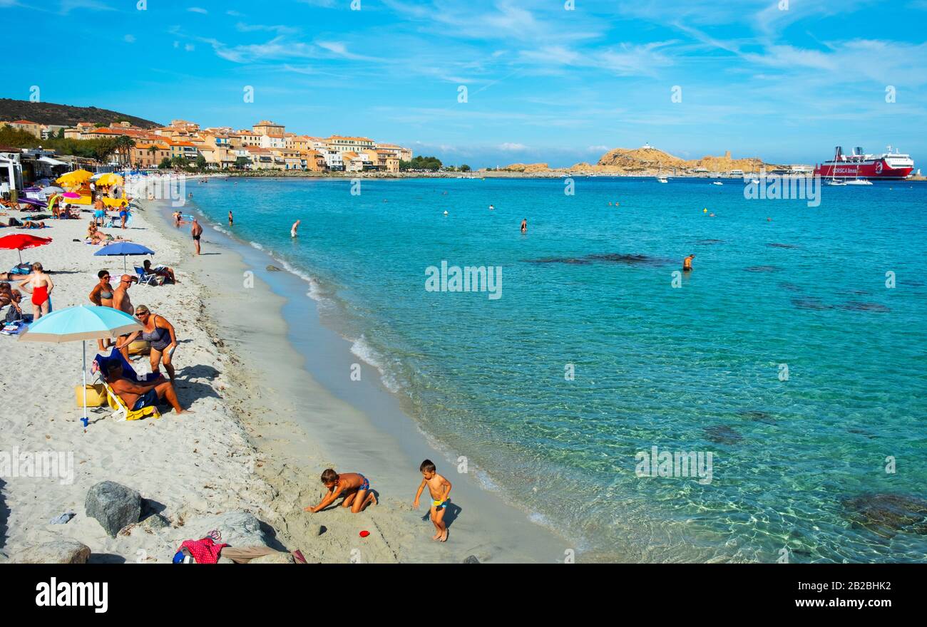 ILE-ROUSSE, FRANCE - SEPTEMBER 22, 2018: People at the main beach of ...