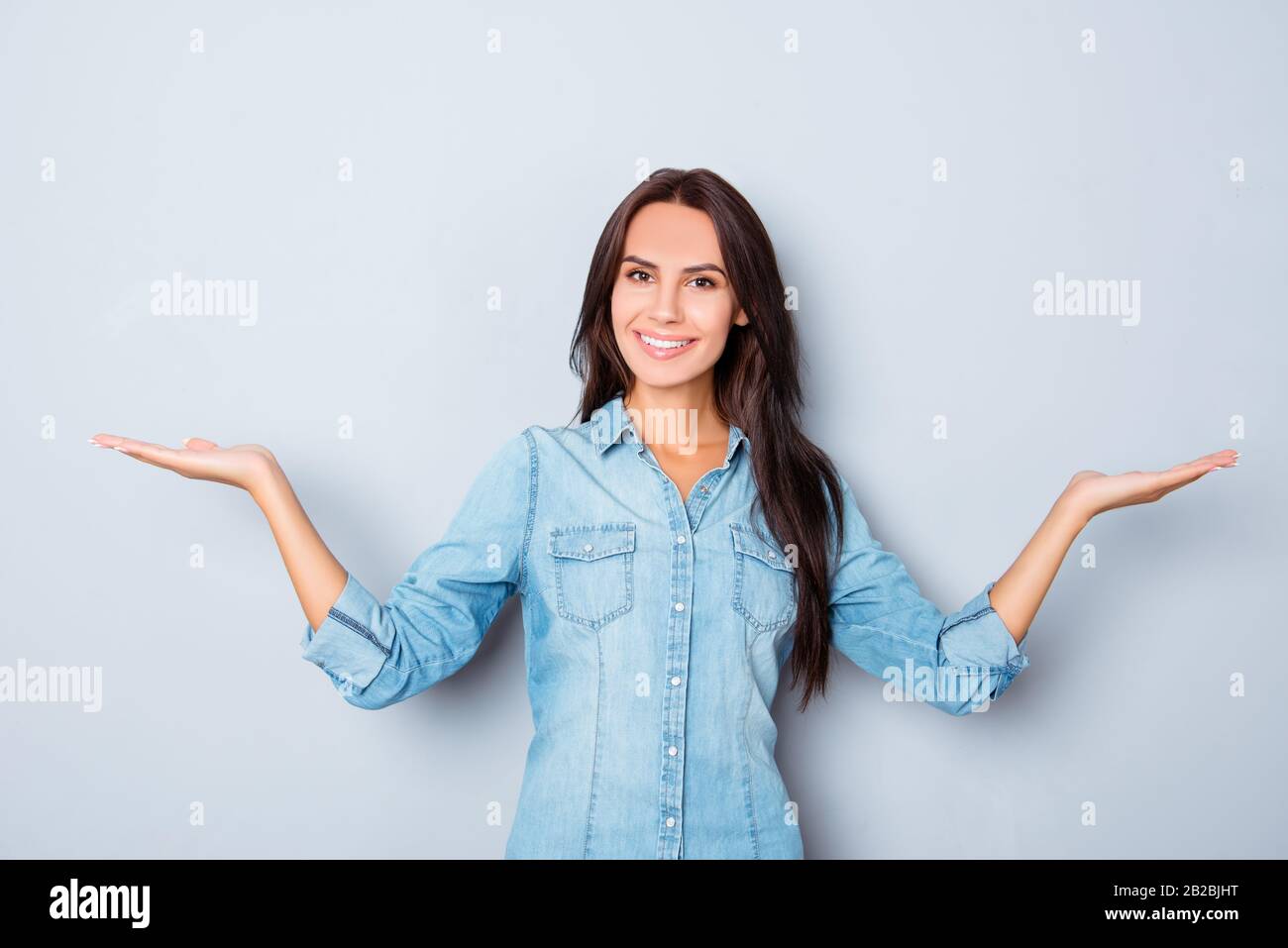 Happy smiling woman gesturing with hands and showing balance Stock ...