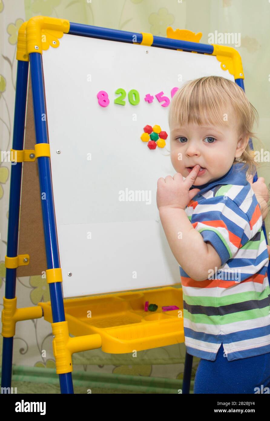 a little boy learning to count Stock Photo - Alamy