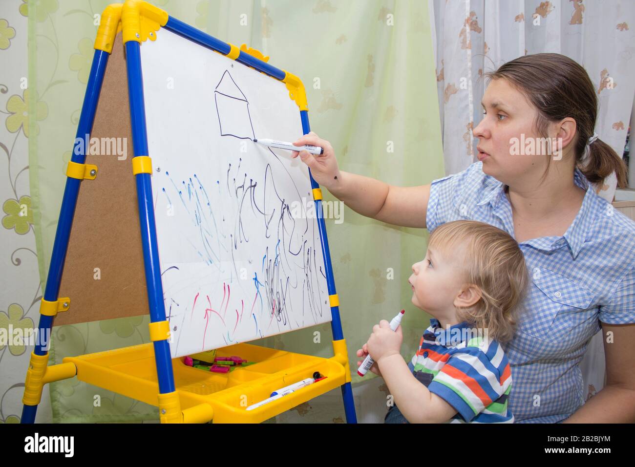The child draws on the board Stock Photo - Alamy