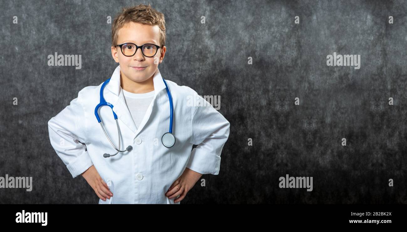 Cute kid boy wear medical uniform playing doctor, a portrait Stock ...