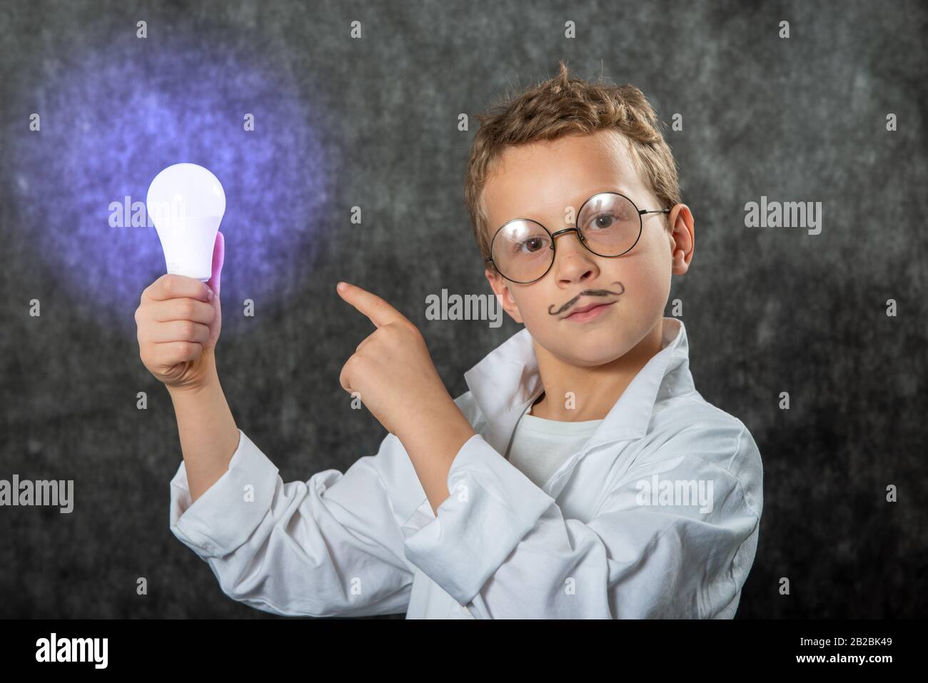 cute smiling child boy with a light bulb Stock Photo - Alamy
