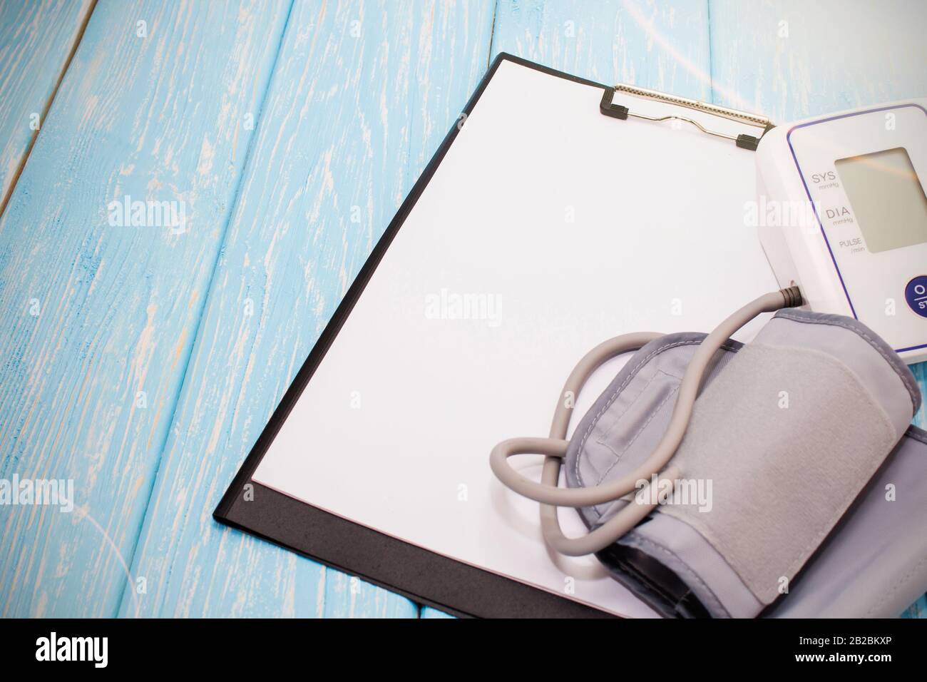 a white sheet of paper, equipment for measuring blood pressure in the ...