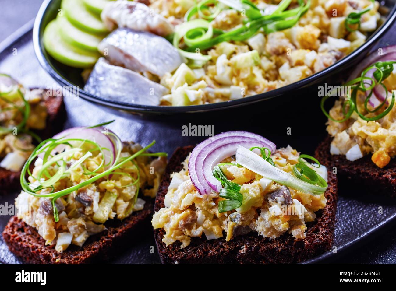 Fish appetizer, minced herring fillet with apple and egg on toasted rye ...