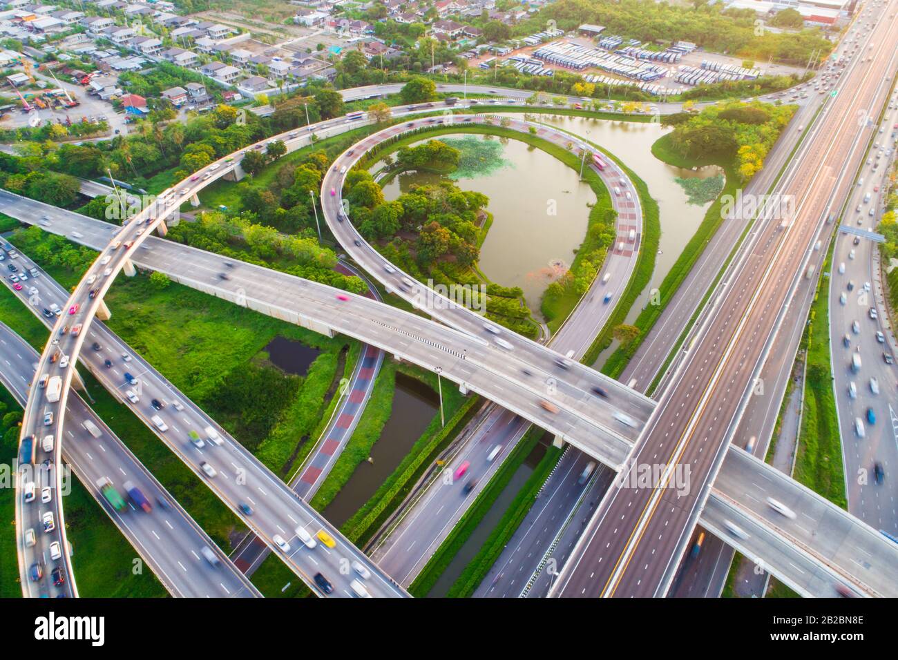 Highway transport traffic road with vehicle movement sunset aerial view ...