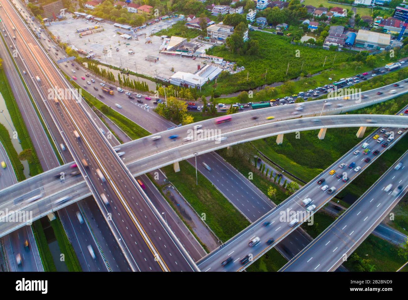 Highway transport traffic road with vehicle movement sunset aerial view ...