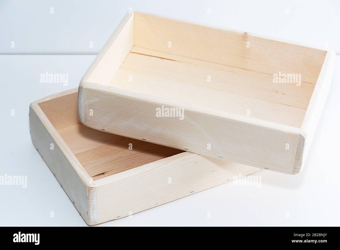 Empty wooden box. Made of pine, on a light white background Stock Photo ...