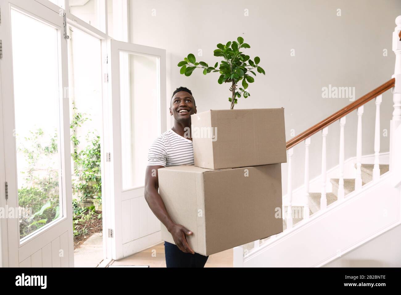 Man moving up stairs hi-res stock photography and images - Alamy