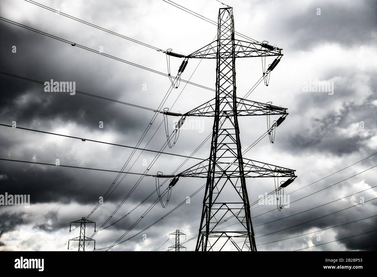 High voltage electricity pylons and power lines background. Industry ...