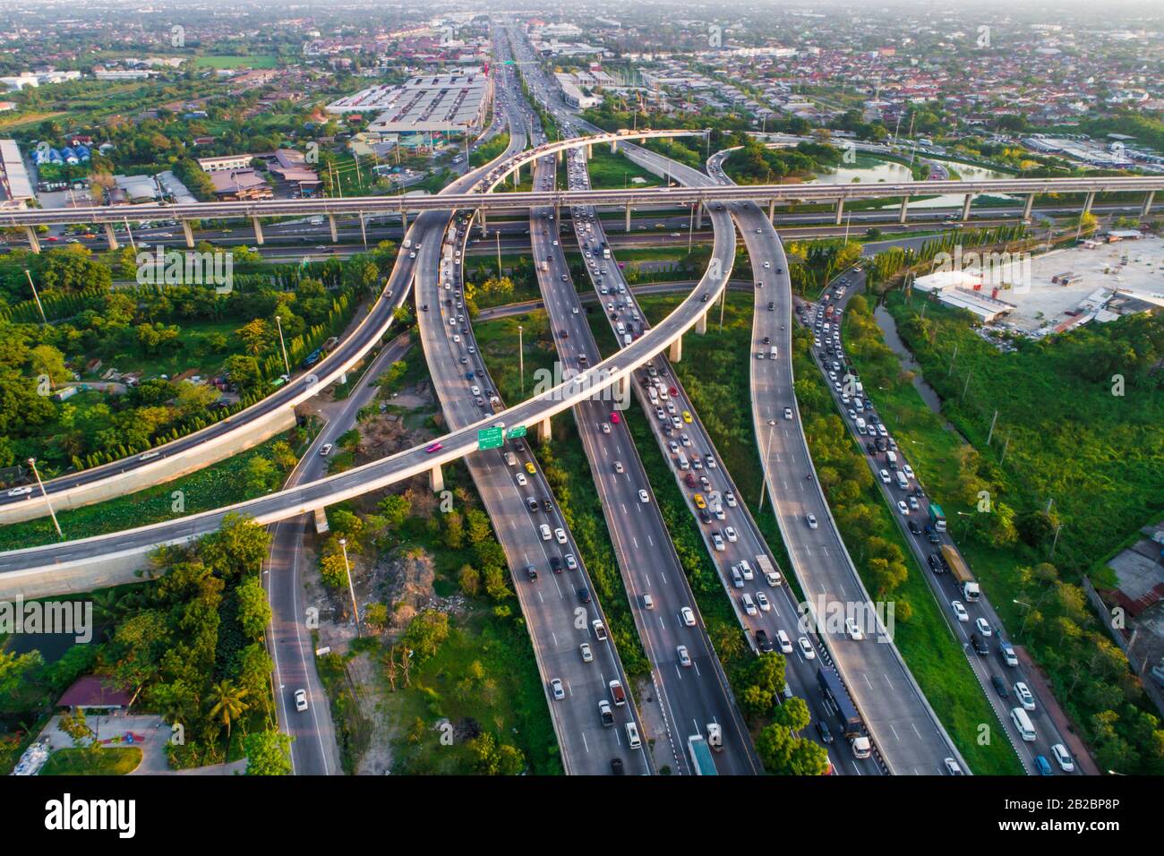 Highway transport traffic road with vehicle movement sunset aerial view ...