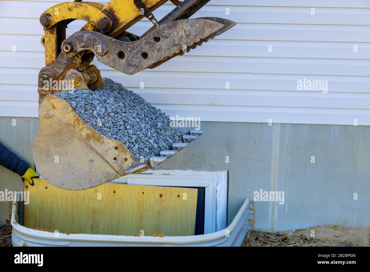 Moving gravel scoop building materials window well for basement ...