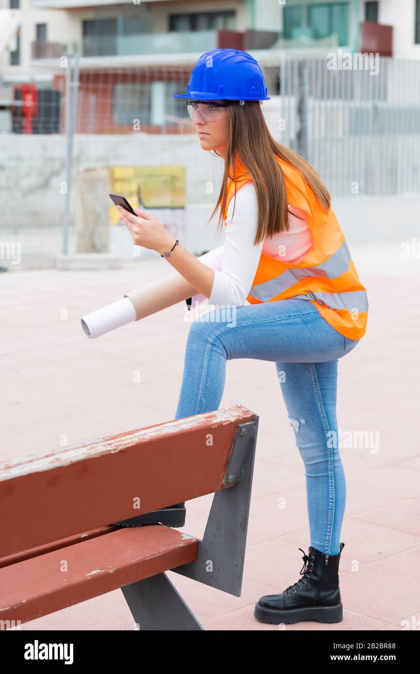 Side view of a teenage apprentice with safety gear Stock Photo - Alamy
