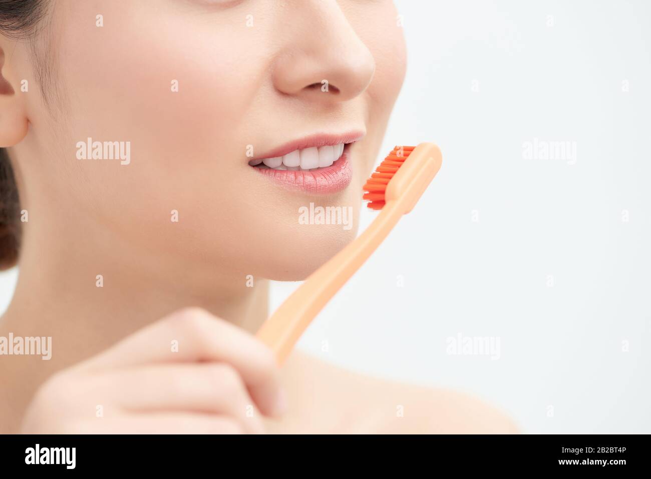 A asian woman cleans to a shine teeth Stock Photo - Alamy