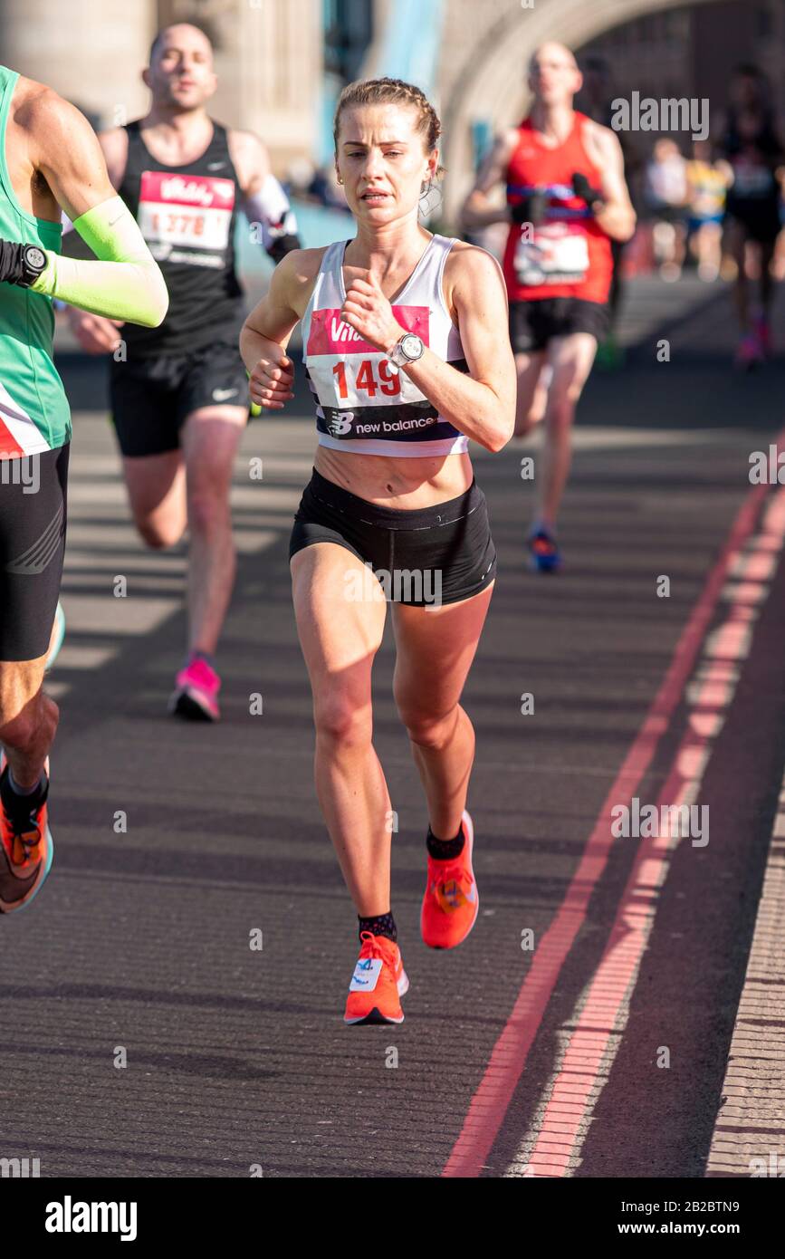 Lucy Reid racing in the Vitality Big Half half marathon crossing Tower Bridge, London, UK ...